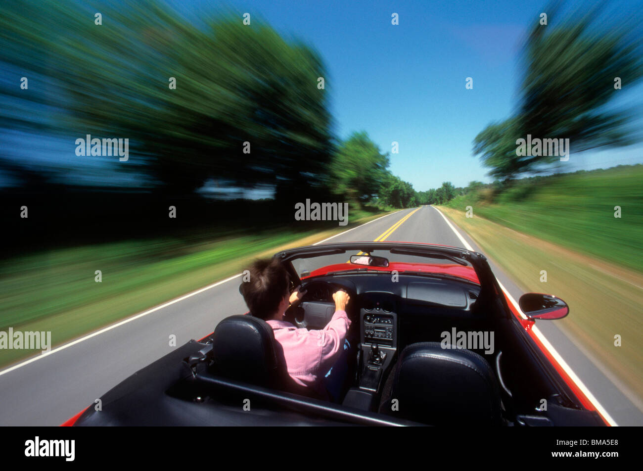 Driving a convertible from behind hi-res stock photography and images ...