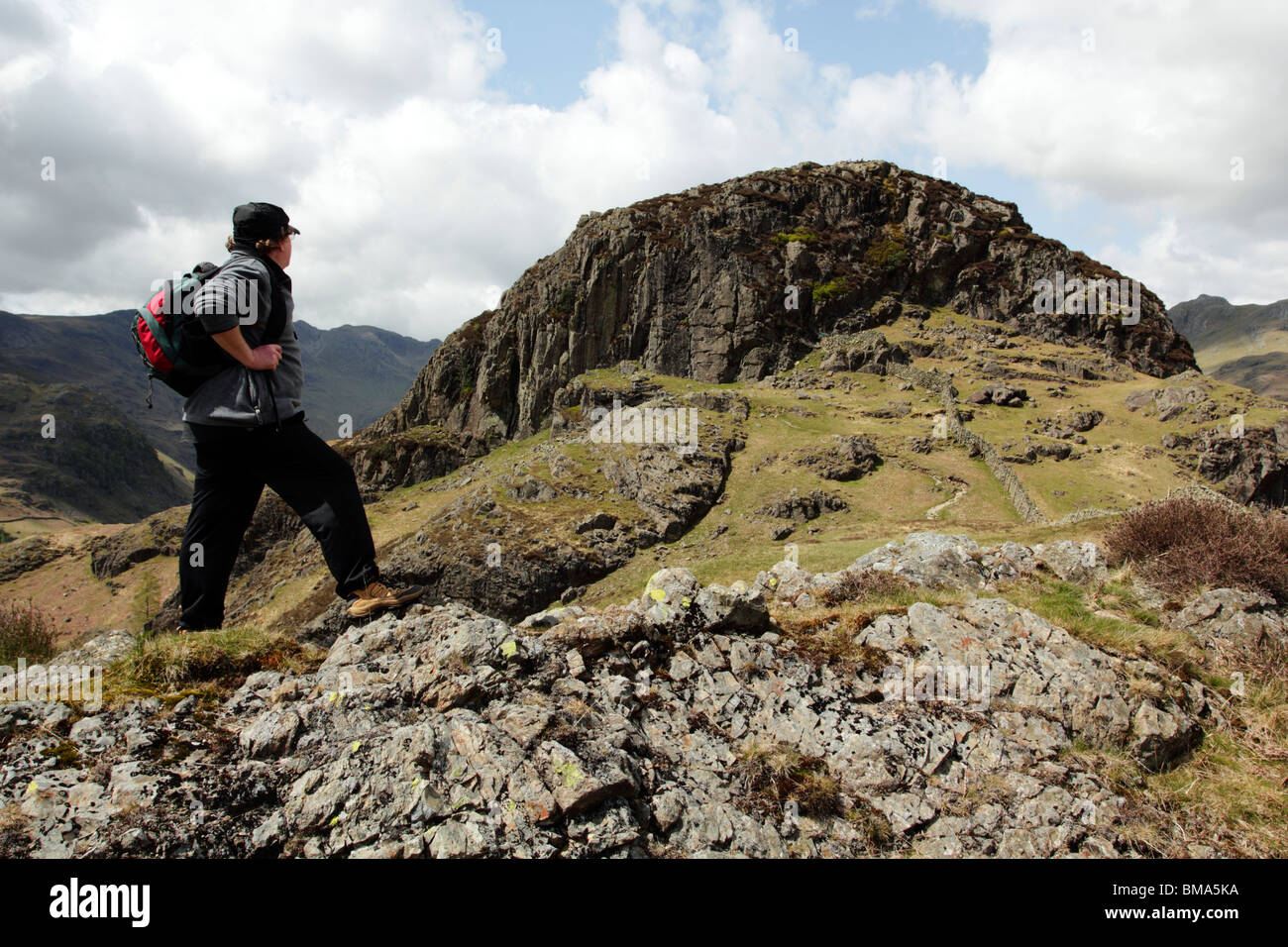Walker looking at Side Pike on Lingmoor in the Lake District National ...