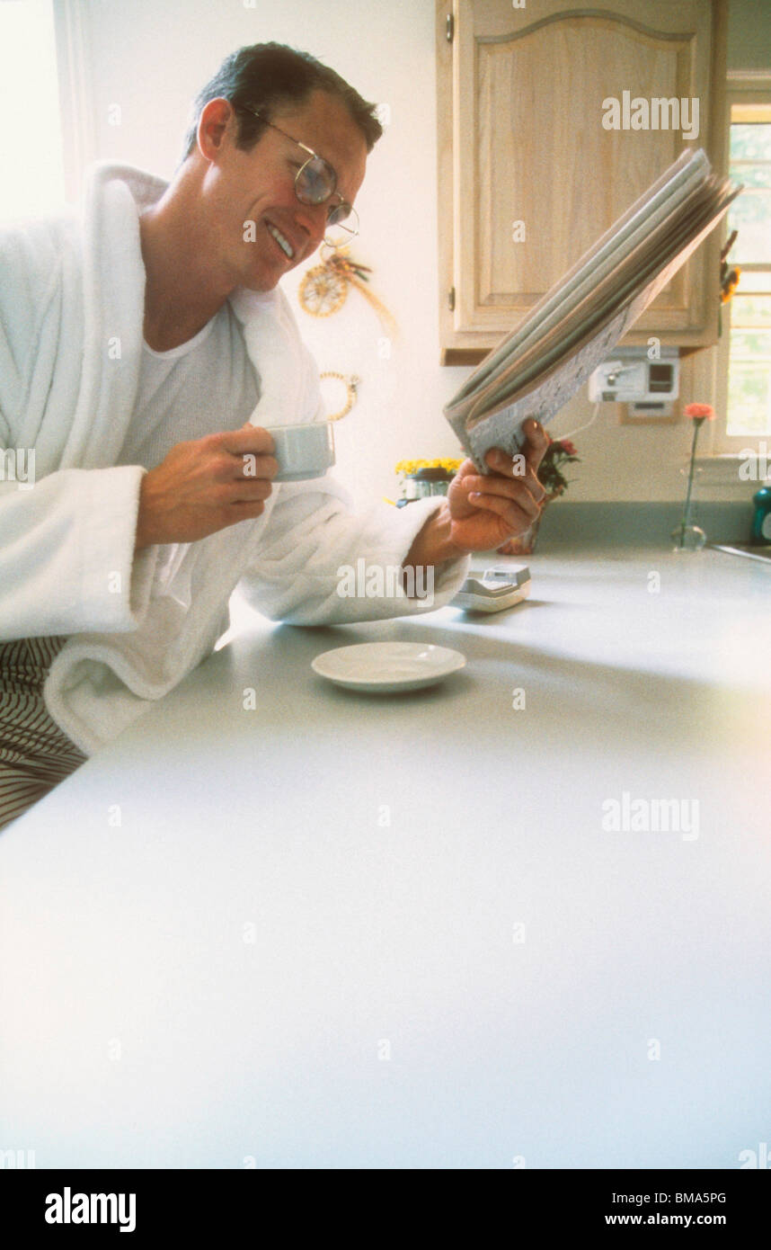 Man reading morning newspaper Stock Photo - Alamy