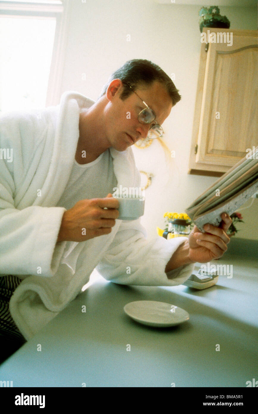 Man reading morning newspaper Stock Photo - Alamy