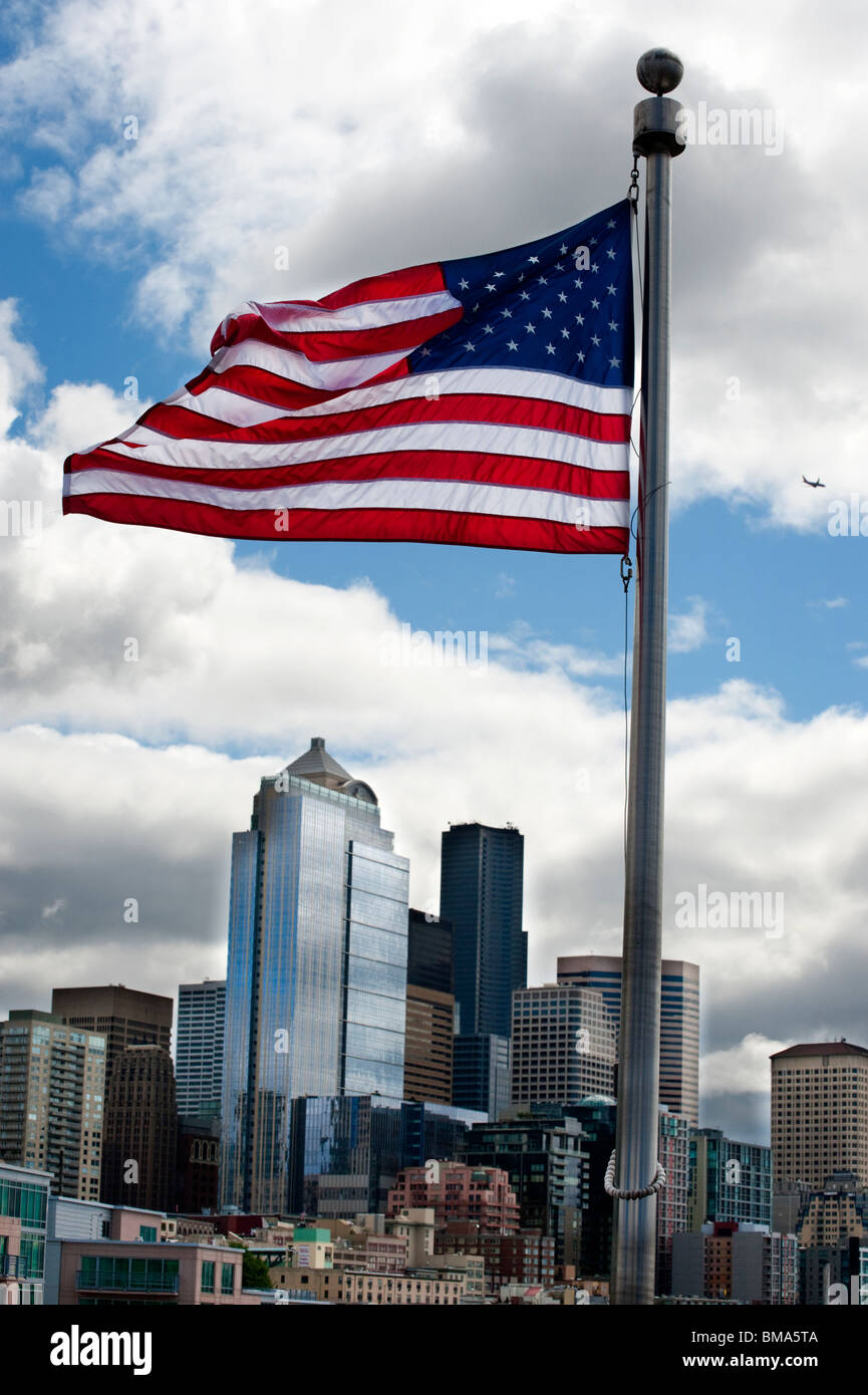 The American flag waves over the Seattle, Washington skyline on a ...