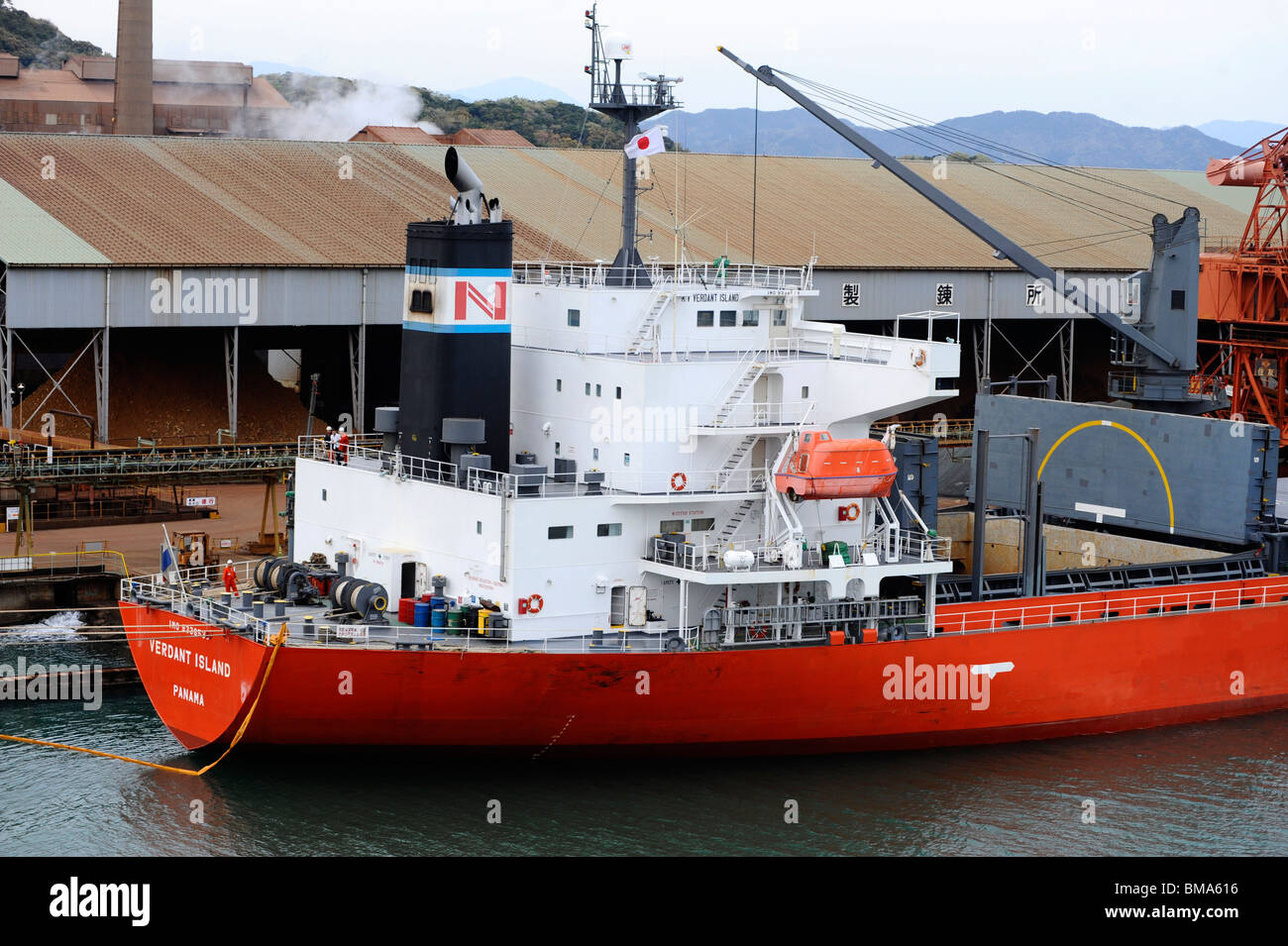 Verdant Island bulk container ship being unloaded in Hyuga docks, Japan ...