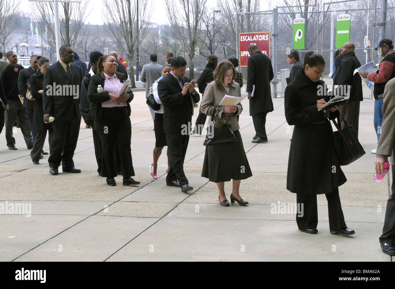 some of the thousands of jobless people in line at a job fair at the ...