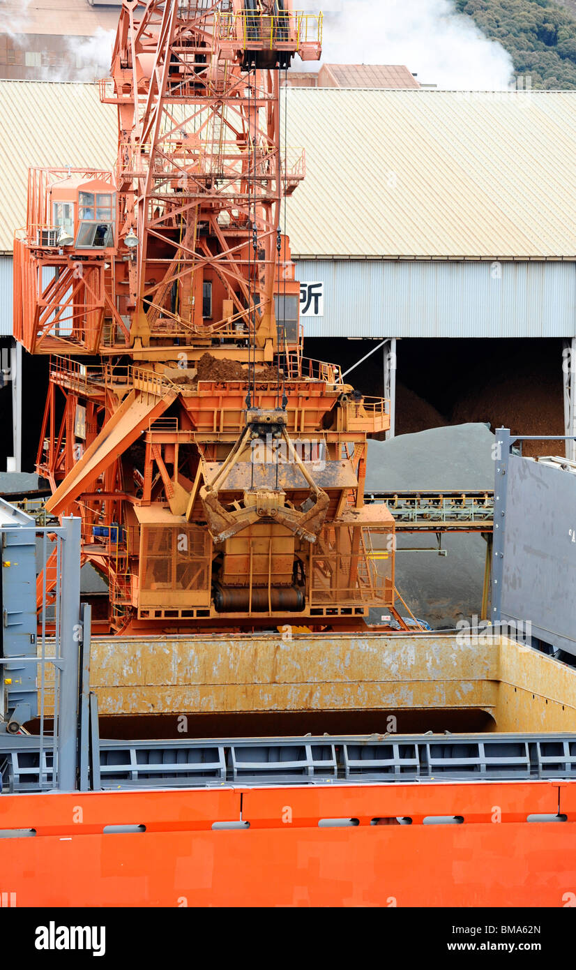 Verdant Island bulk container ship being unloaded in Hyuga docks, Japan ...