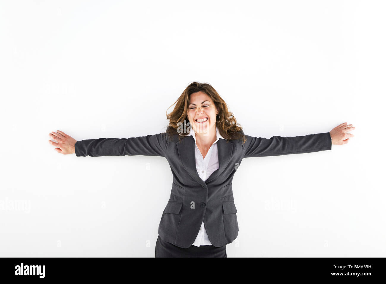 Woman With Her Arms Raised Stock Photo - Alamy