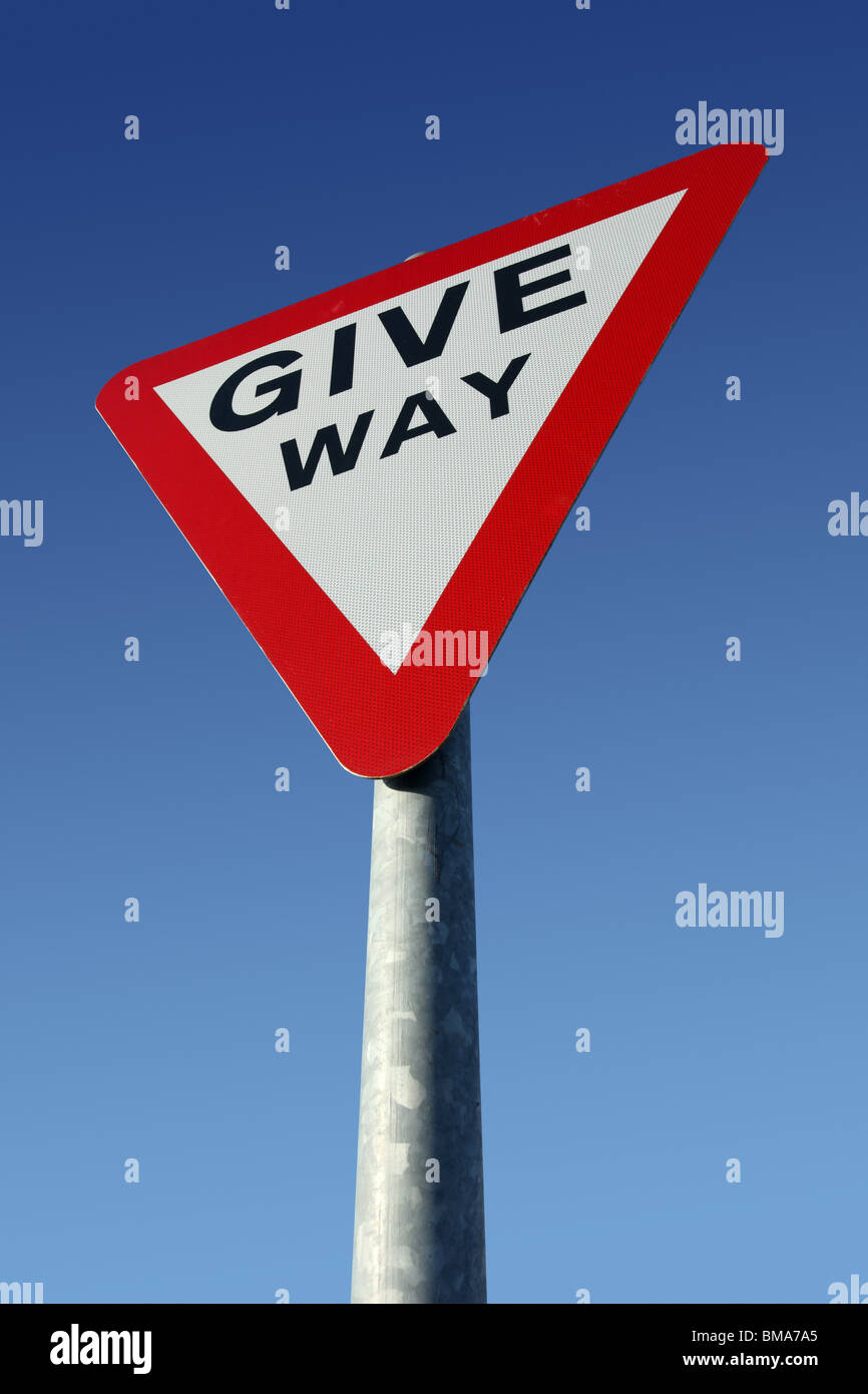 British give way road sign and a blue sky Stock Photo - Alamy