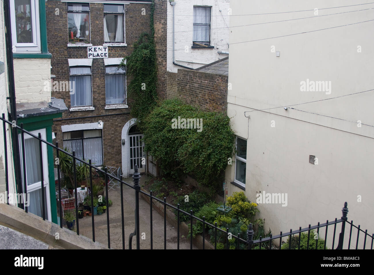 seaside housing flats narrow courtyard tenement Stock Photo - Alamy