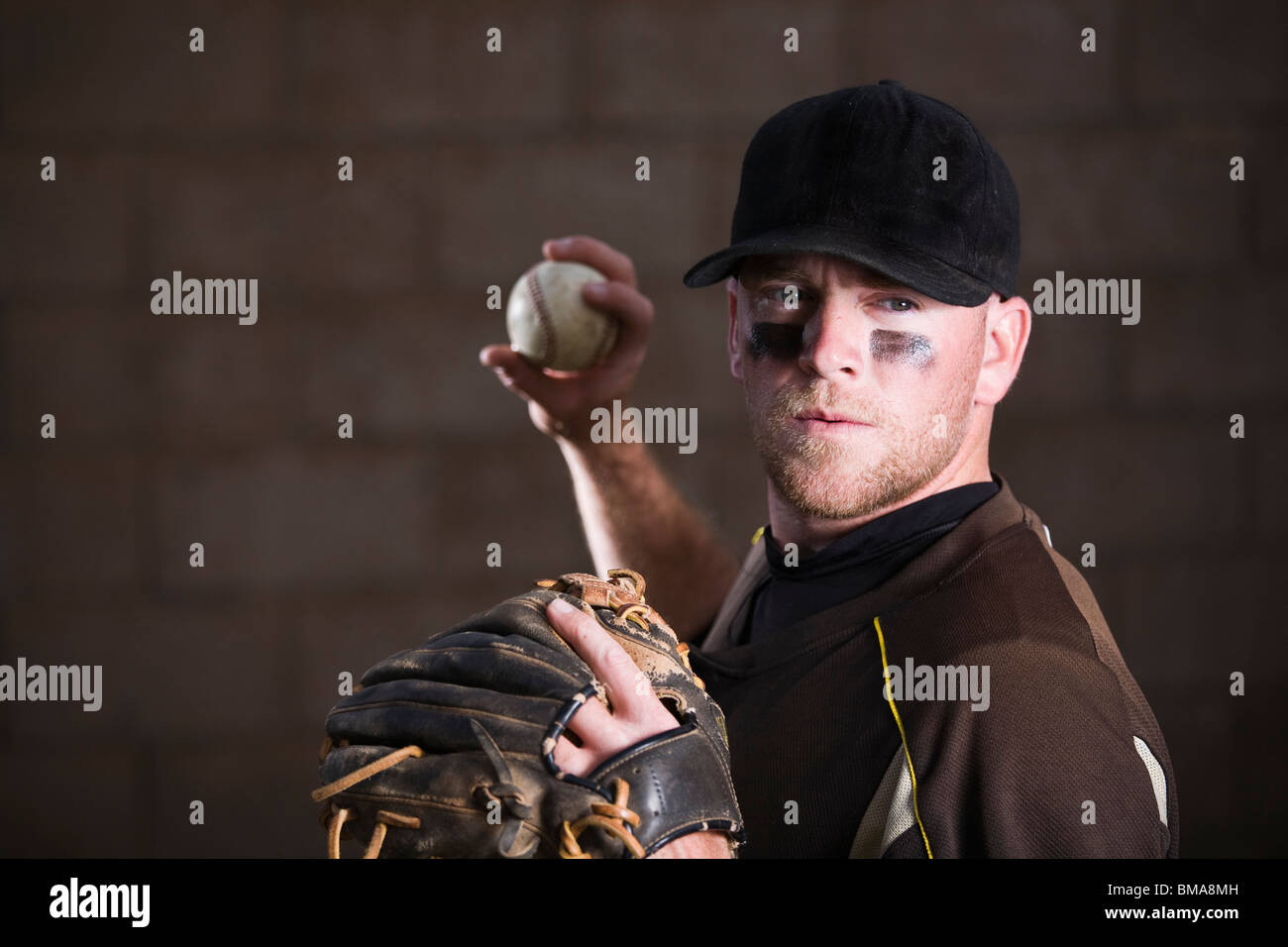 Baseball player fielding and throwing ball Stock Photo - Alamy