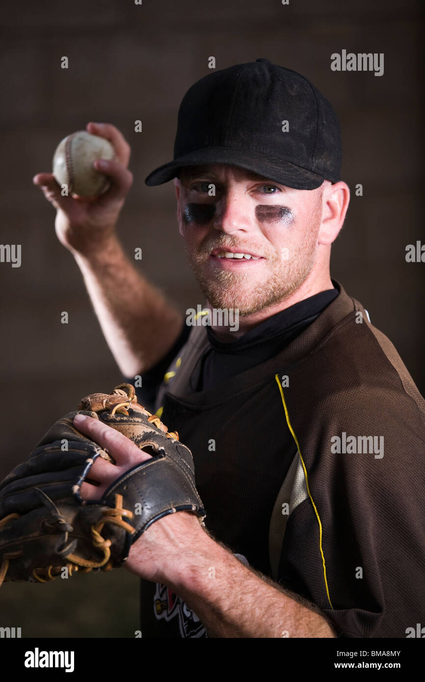 Baseball player fielding and throwing ball Stock Photo - Alamy