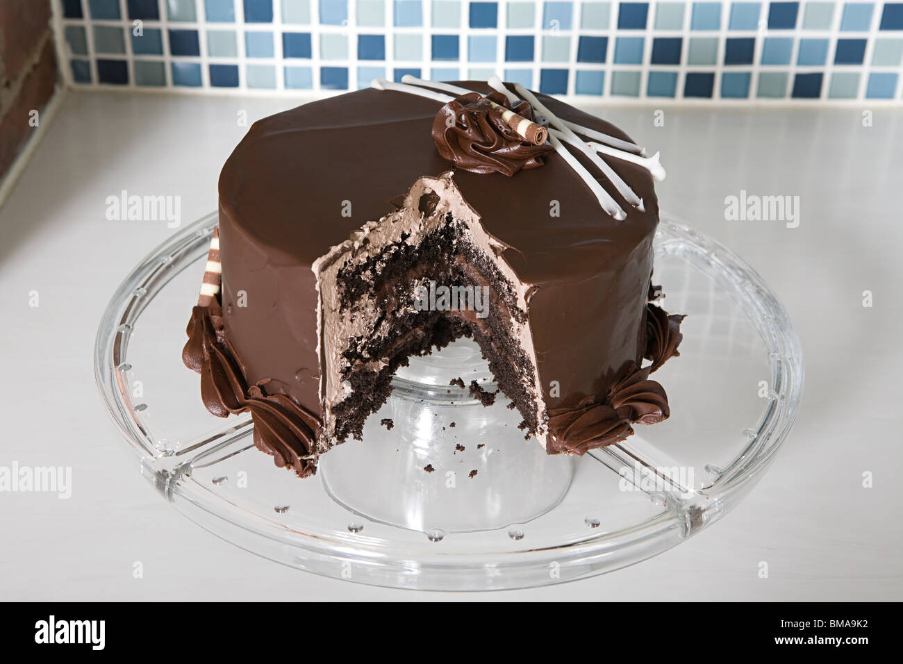 Chocolate cake with missing slice Stock Photo - Alamy