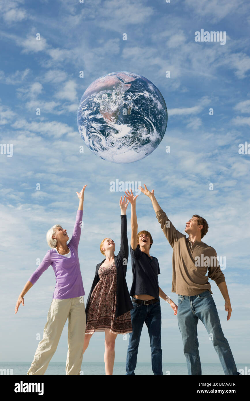 Ecology concept, group of people saving the earth together Stock Photo ...