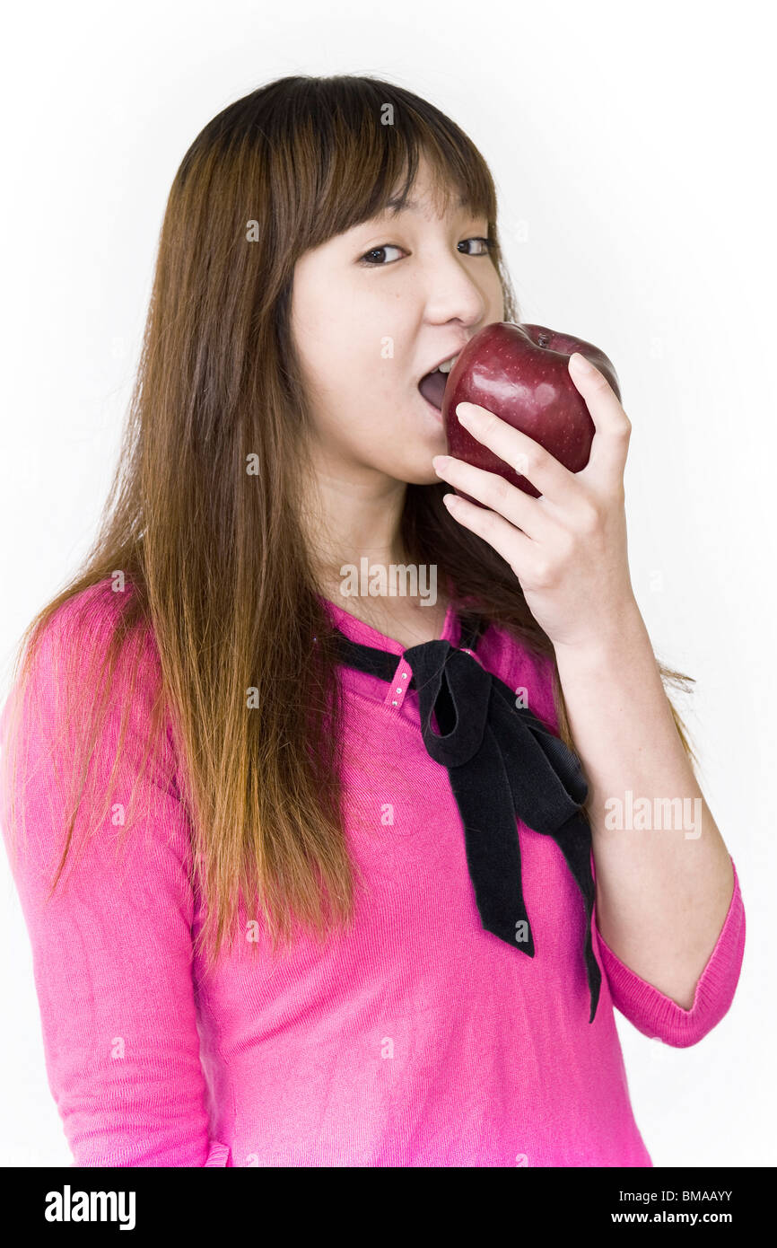 Chinese girl with apple Stock Photo - Alamy