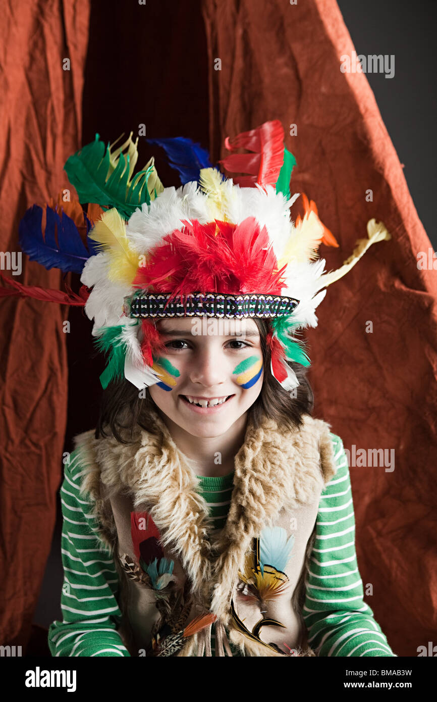 Young boy dressed up in Native American outfit, with teepee Stock Photo ...