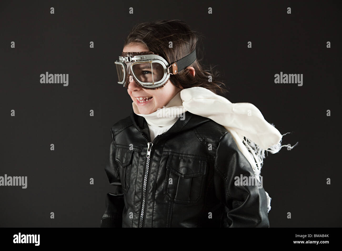 Young boy wearing flying goggles, dressed as pilot Stock Photo - Alamy