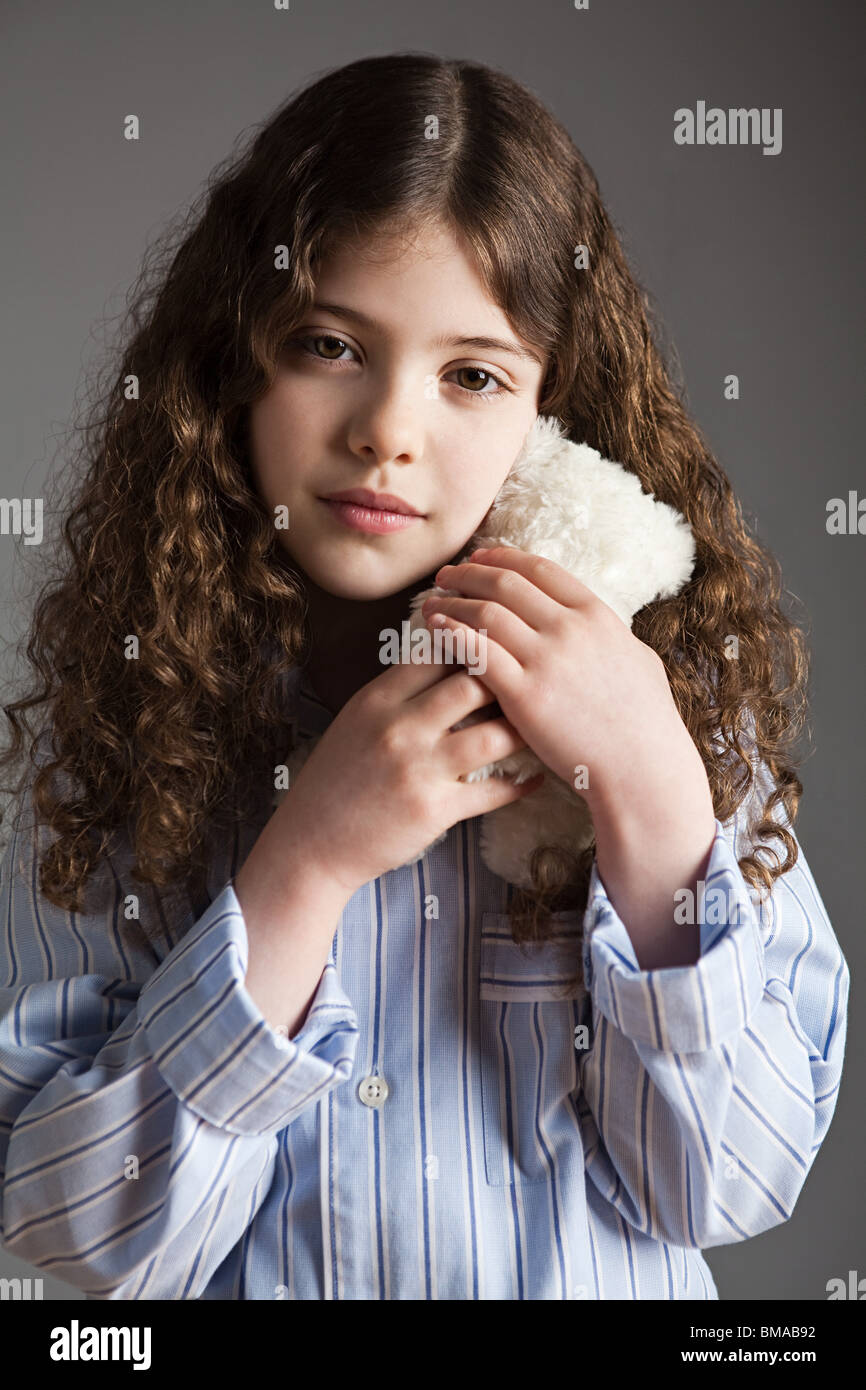 Young girl dressed in pyjamas holding teddy bear Stock Photo - Alamy Young girl dressed in pyjamas holding teddy bear Stock Photo - Alamy