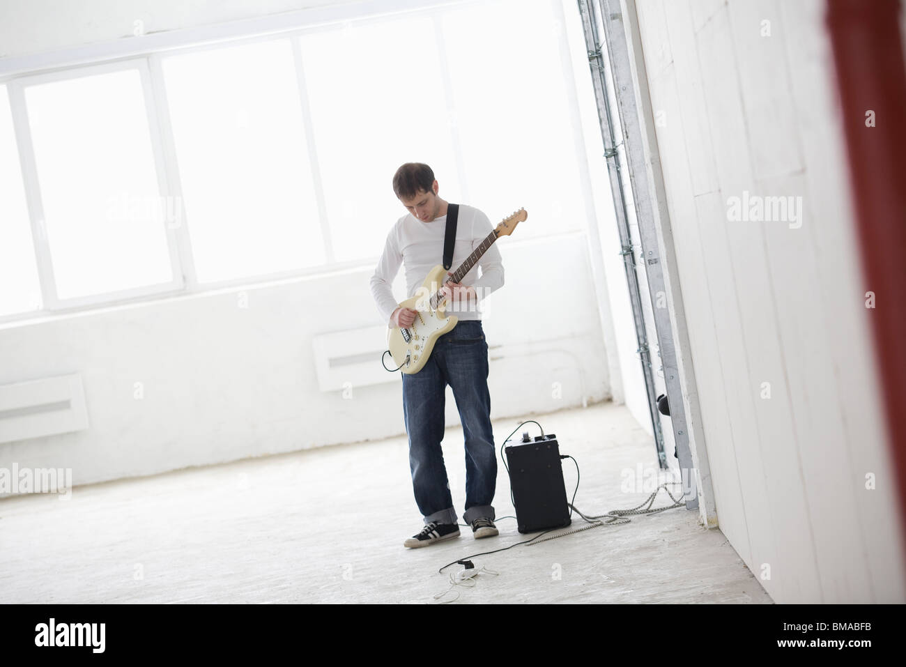 Person standing playing electric guitar hi-res stock photography and ...
