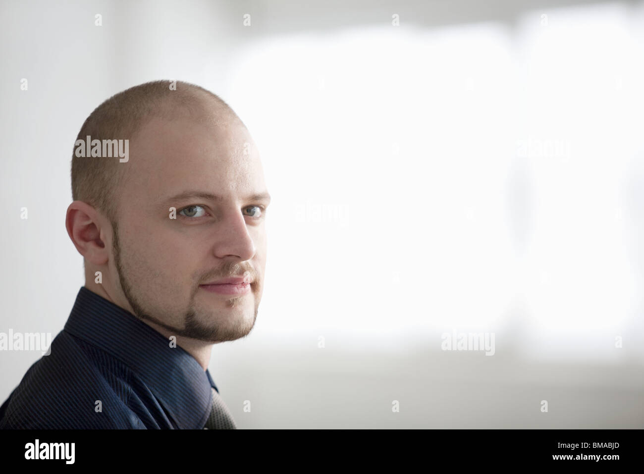 Portrait of young businessman, smiling Stock Photo - Alamy