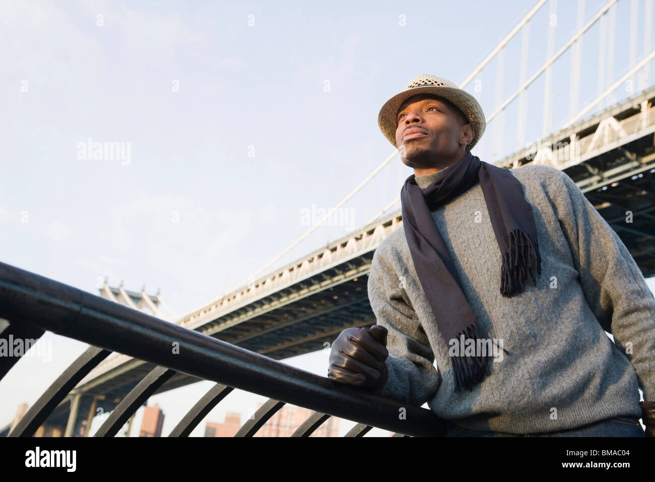 Man Standing in front of Bridge Stock Photo - Alamy