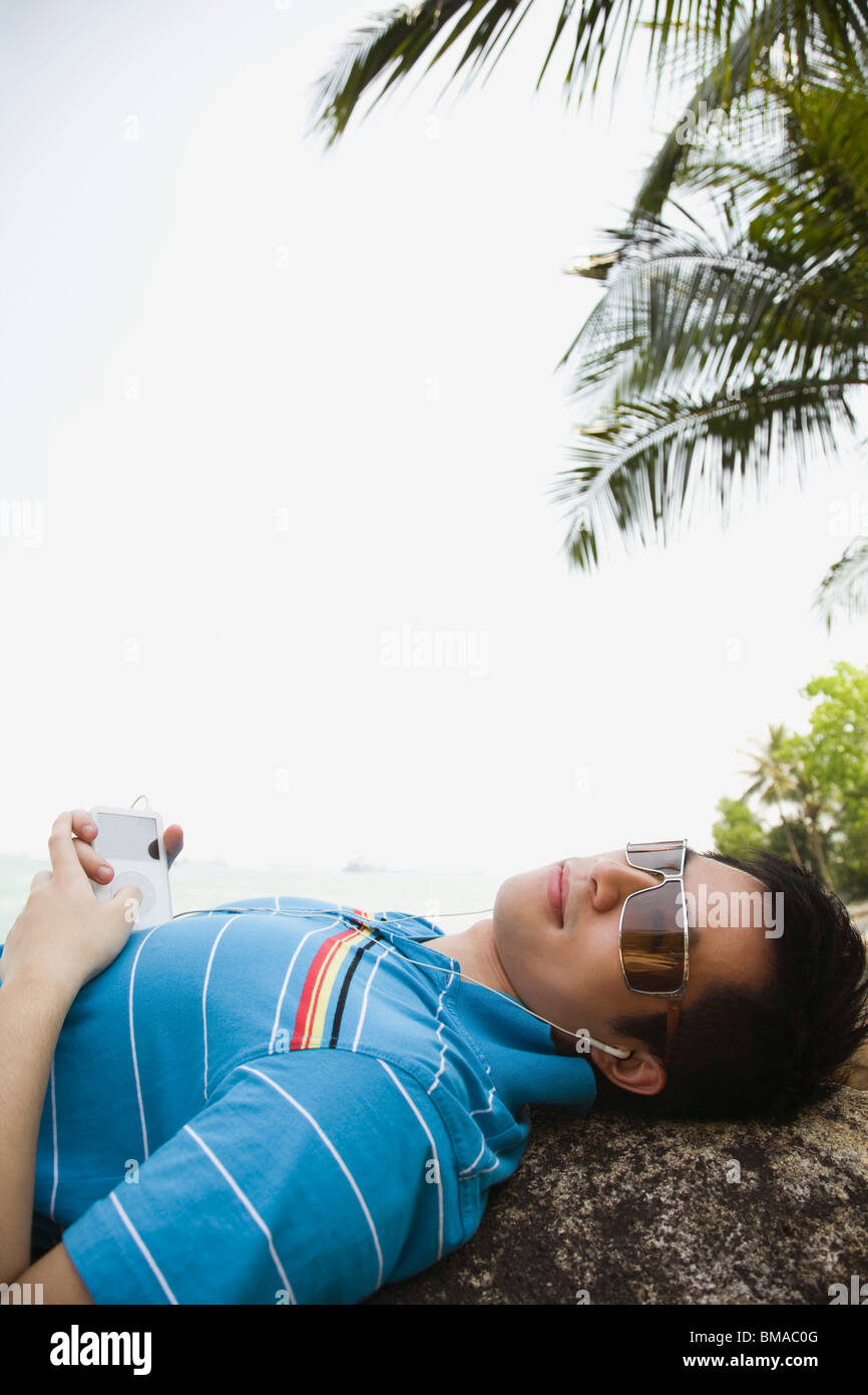 Man Listening to MP3 Player Outdoors Stock Photo - Alamy