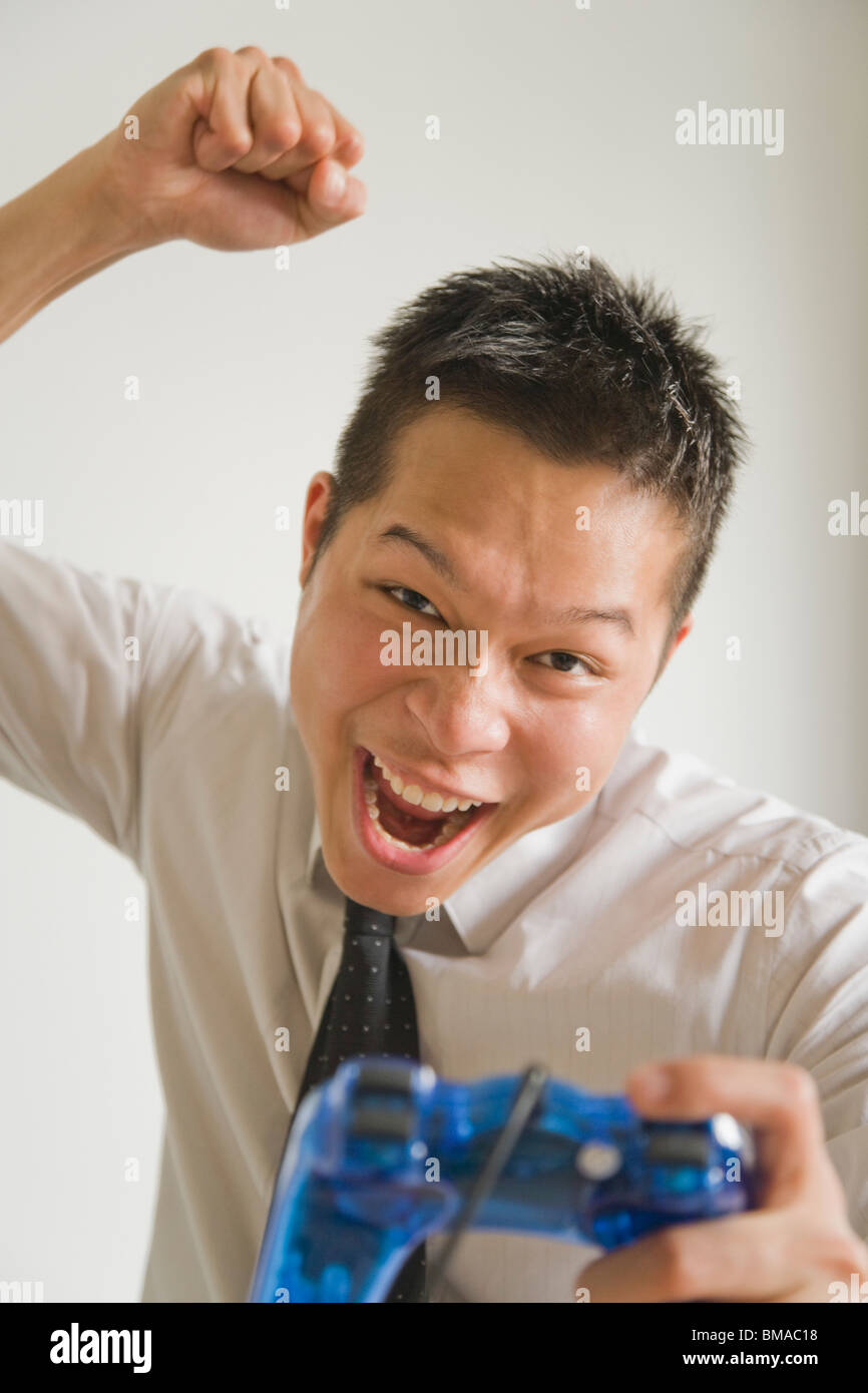 Businessman Playing Video Game Stock Photo - Alamy