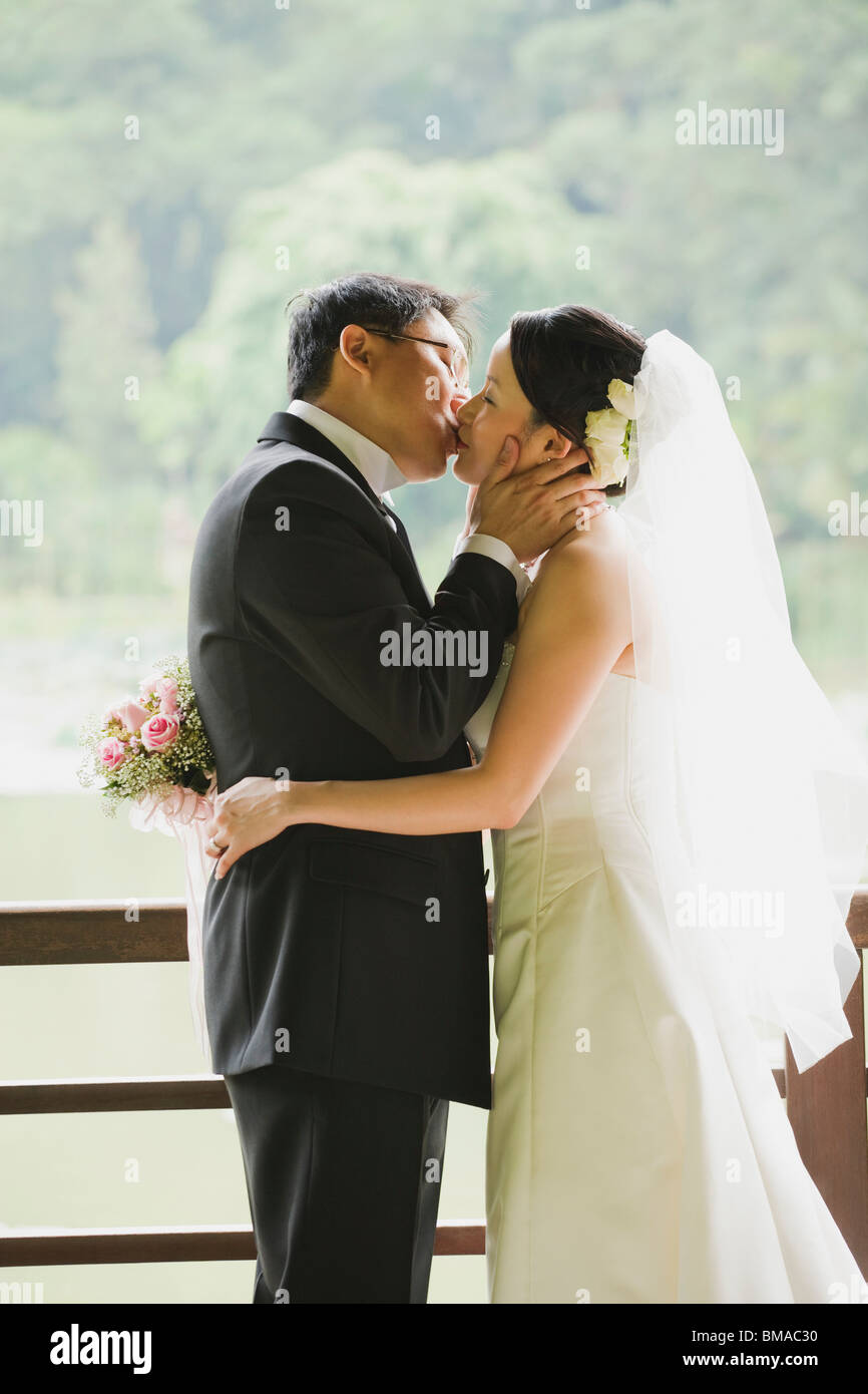 Bride and Groom Kissing Stock Photo - Alamy