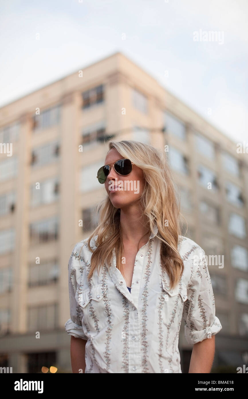 Portrait of Woman Standing in Front of Building Stock Photo - Alamy