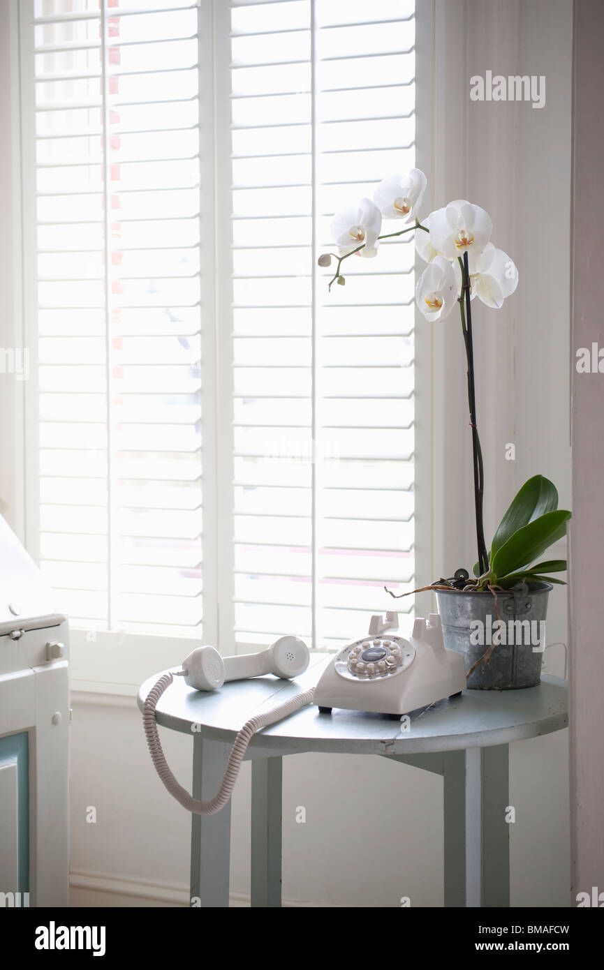 Rotary phone off the hook on a side table in London Stock Photo - Alamy