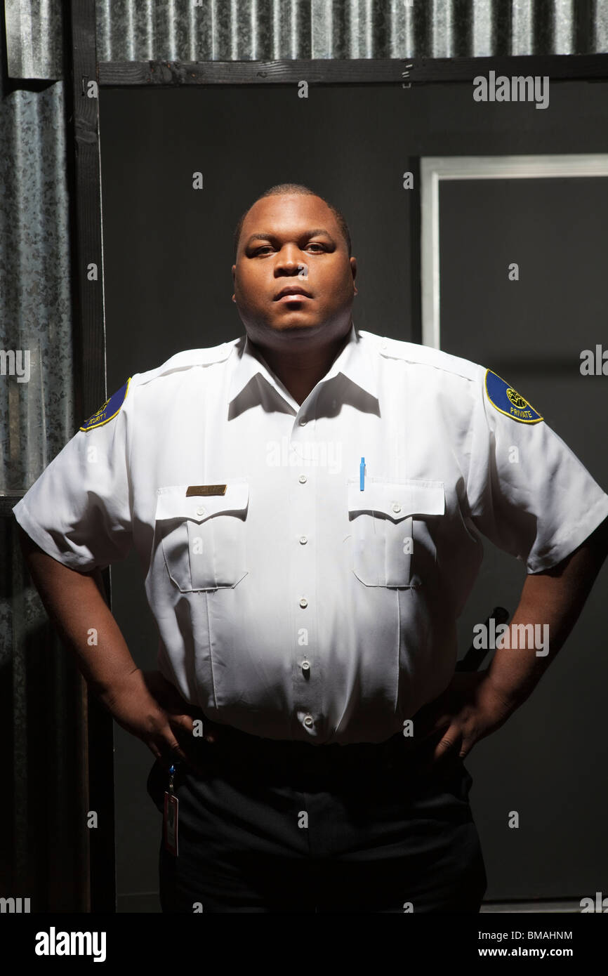 Standing uniform security guard authority hi-res stock photography and ...