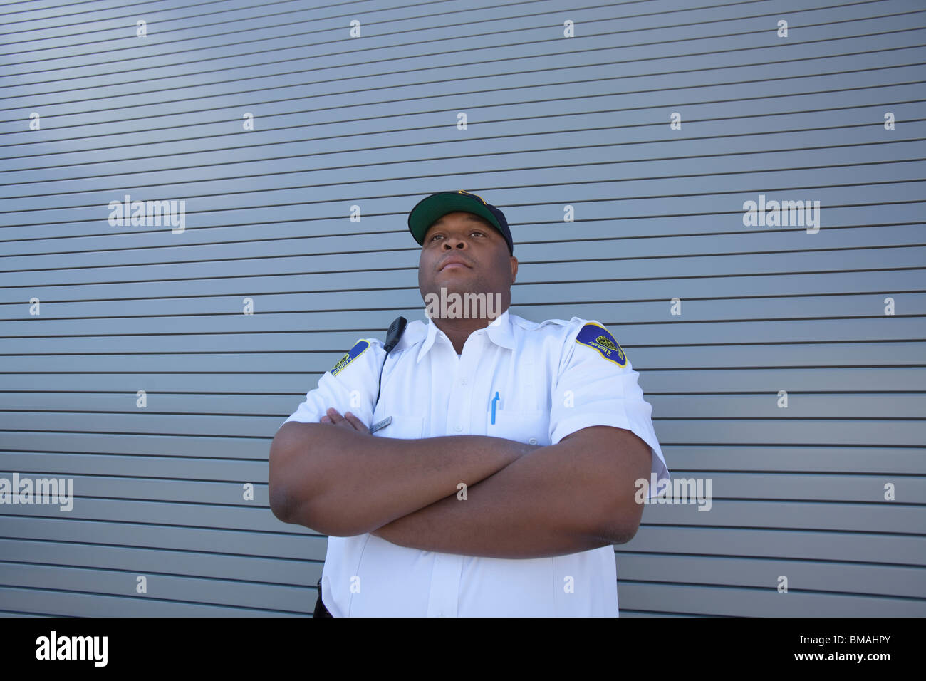 Standing uniform security guard authority hi-res stock photography and ...