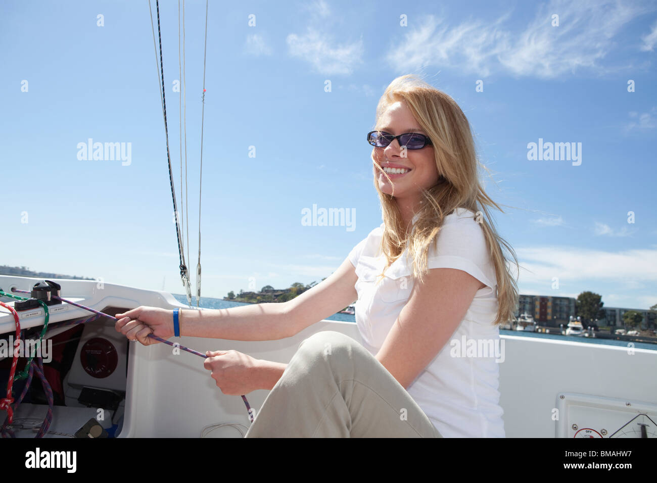 Young woman sailing Stock Photo - Alamy