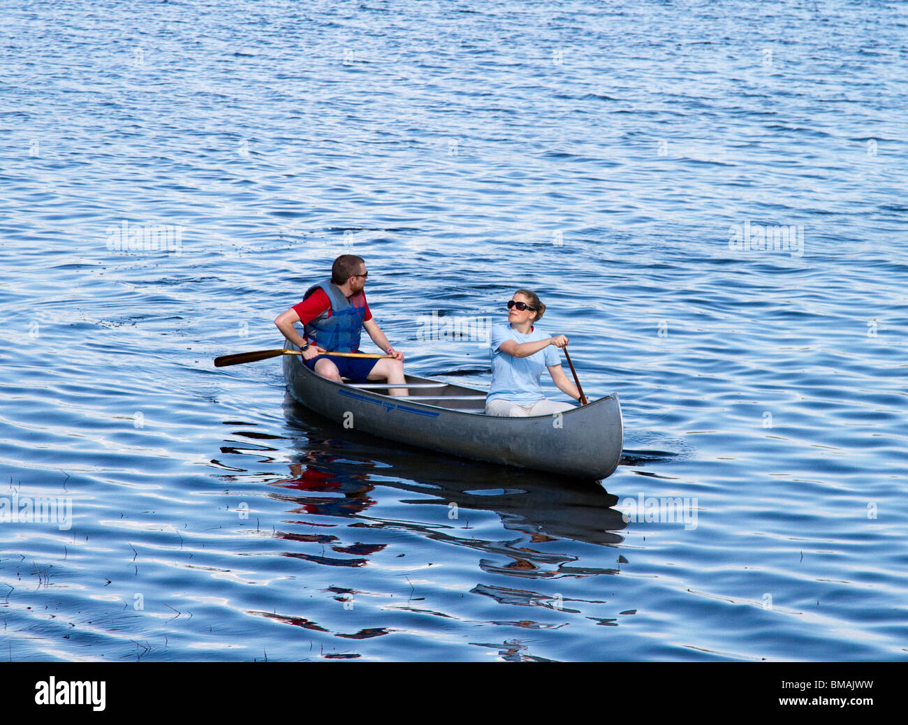 Couple canoing lake hi-res stock photography and images - Alamy