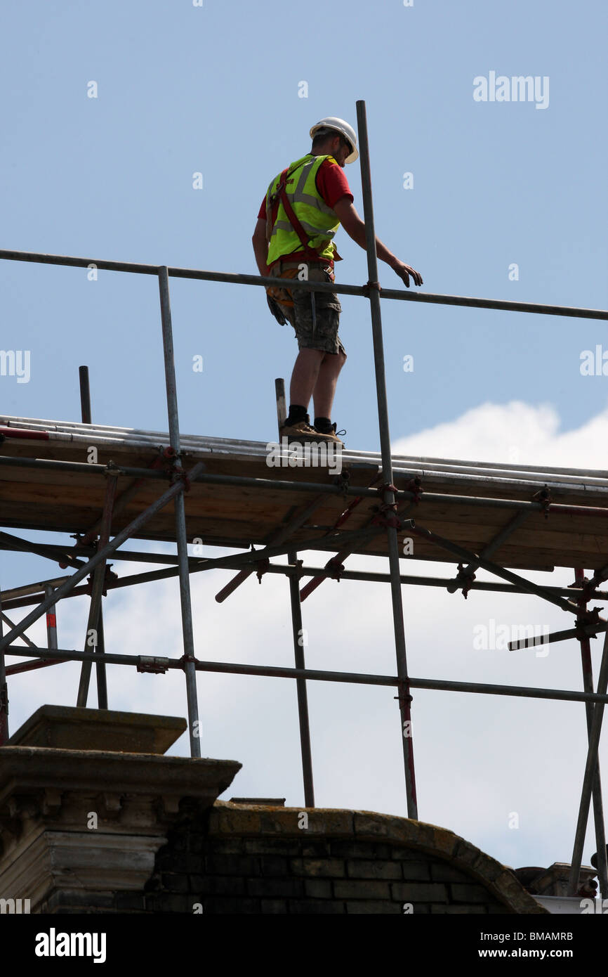 BUILDERS ON SCAFFOLD Stock Photo - Alamy
