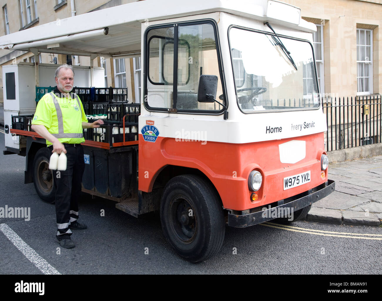 Milkman And Traditional Milk Float Bath England UK Stock Photo Milkman And Traditional Milk Float Bath England UK Stock Photo