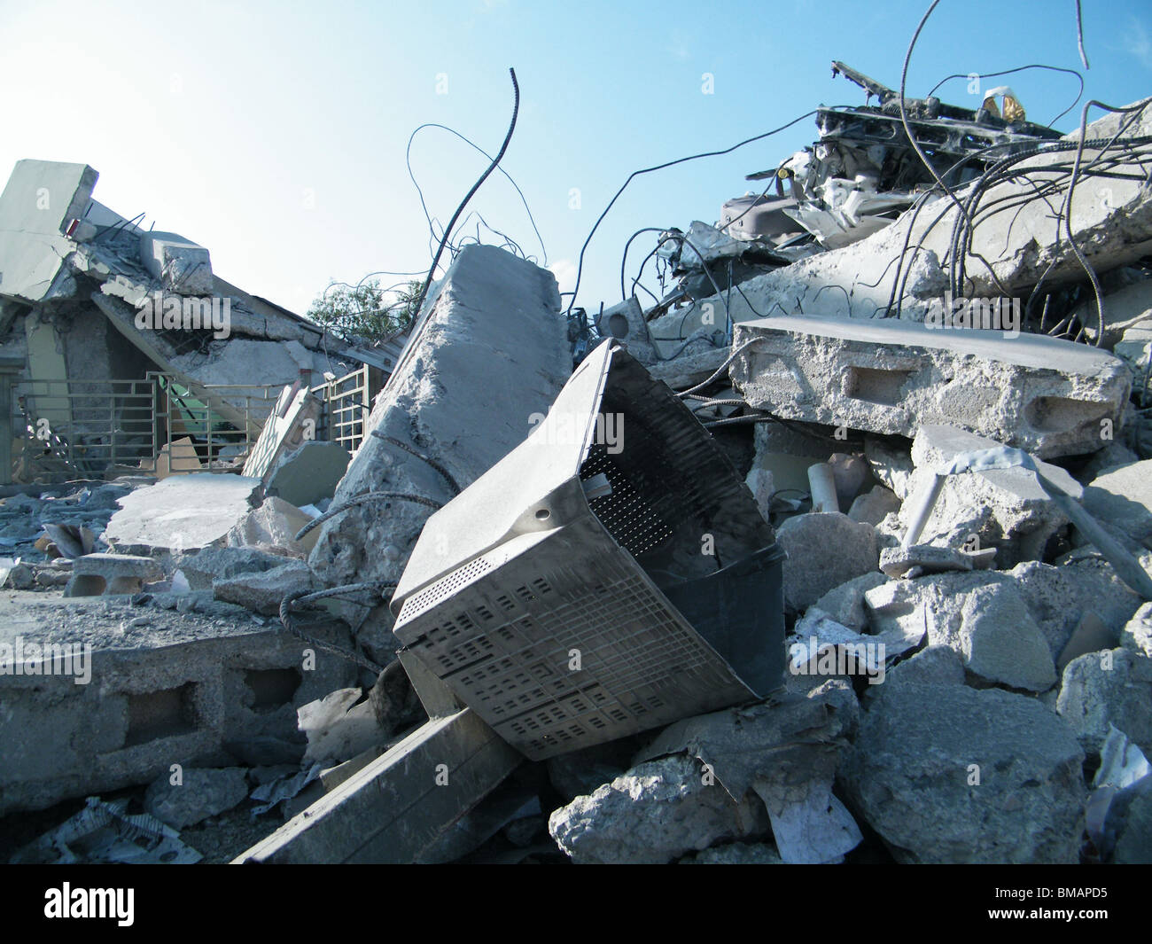 A computer lies in the rubble of a collapsed office in Port au Prince ...