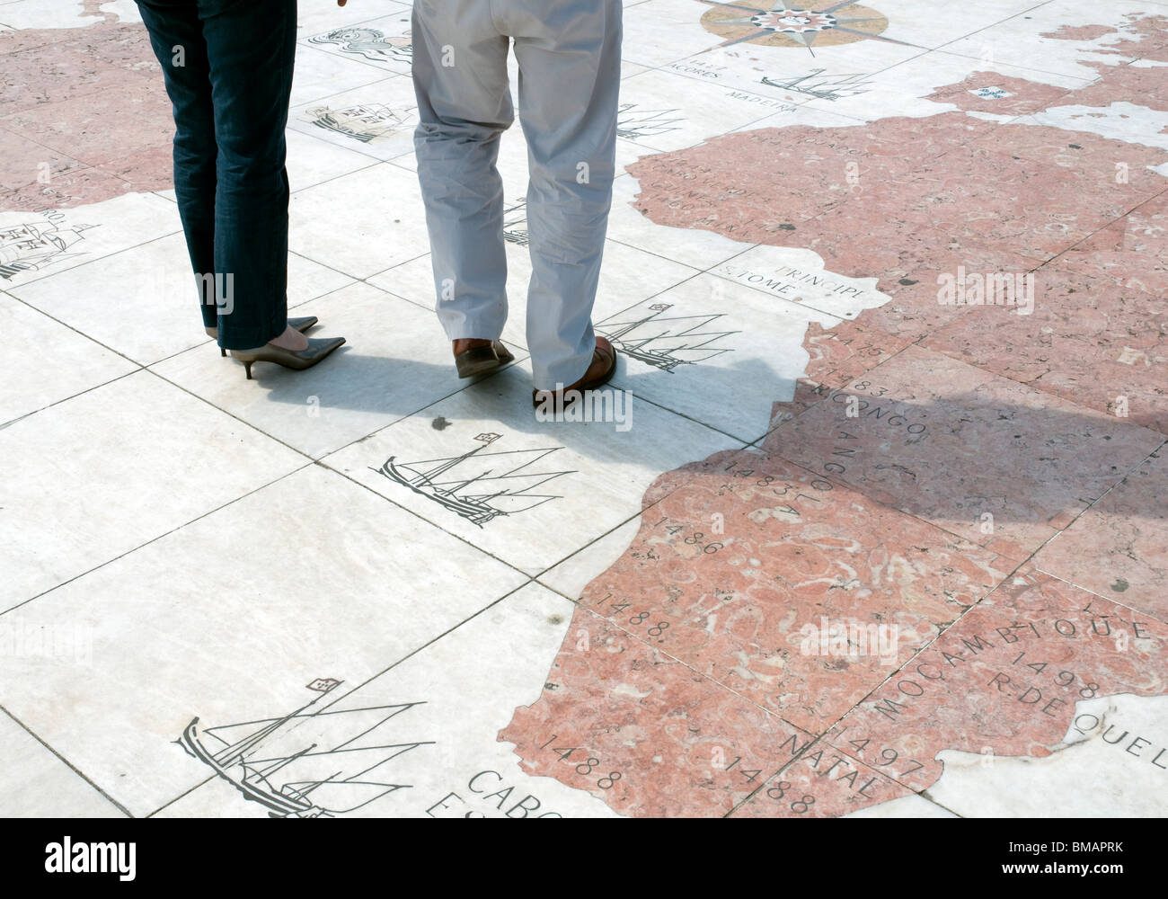 Visitors to the pavement compass in front of the Monument to the ...