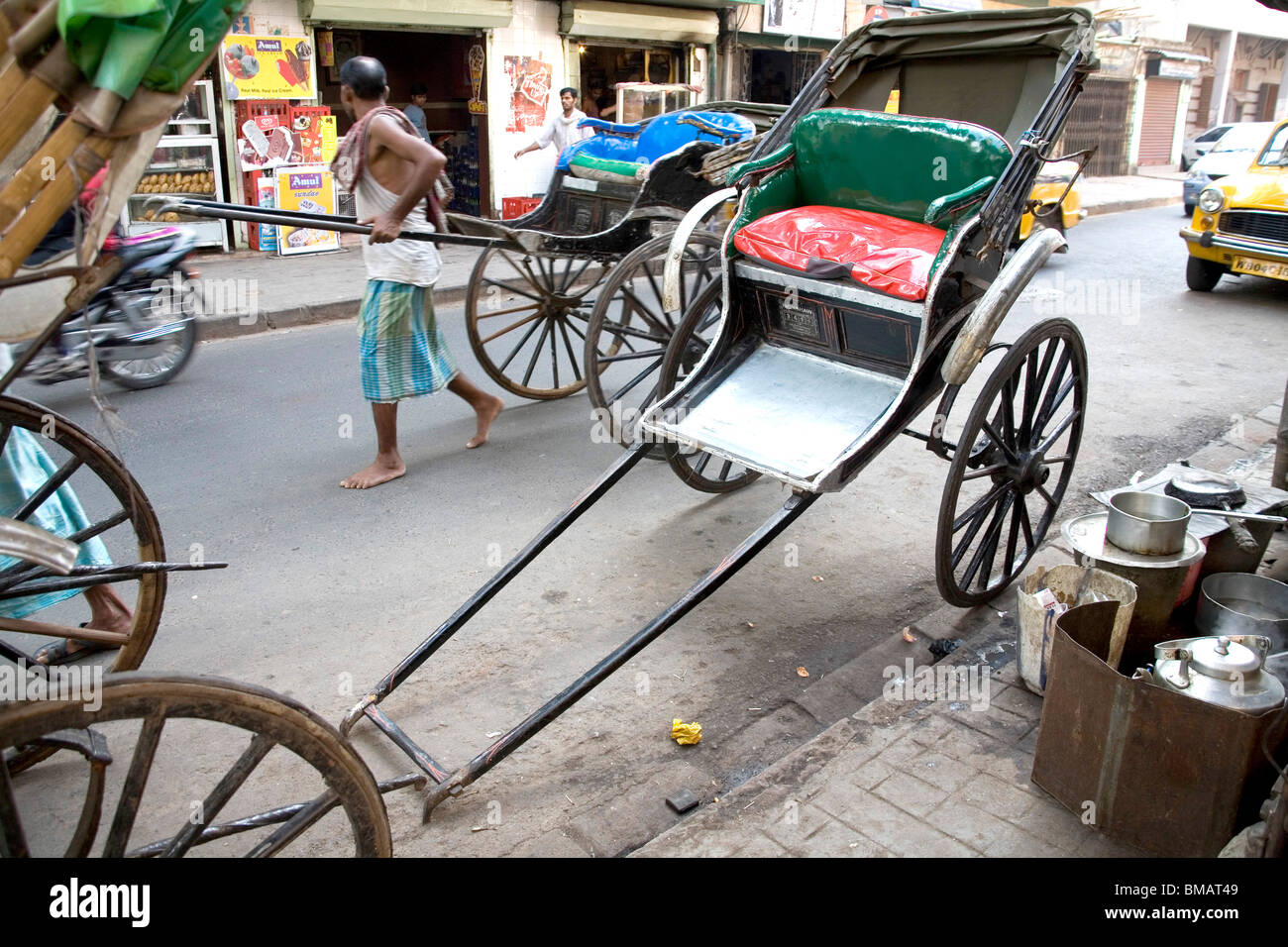 Empty hand rickshaw ; manual labor rickshaw puller with vehicle ; Park ...