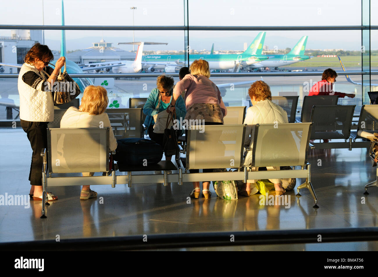 Dublin International Airport terminal interior with female passengers ...