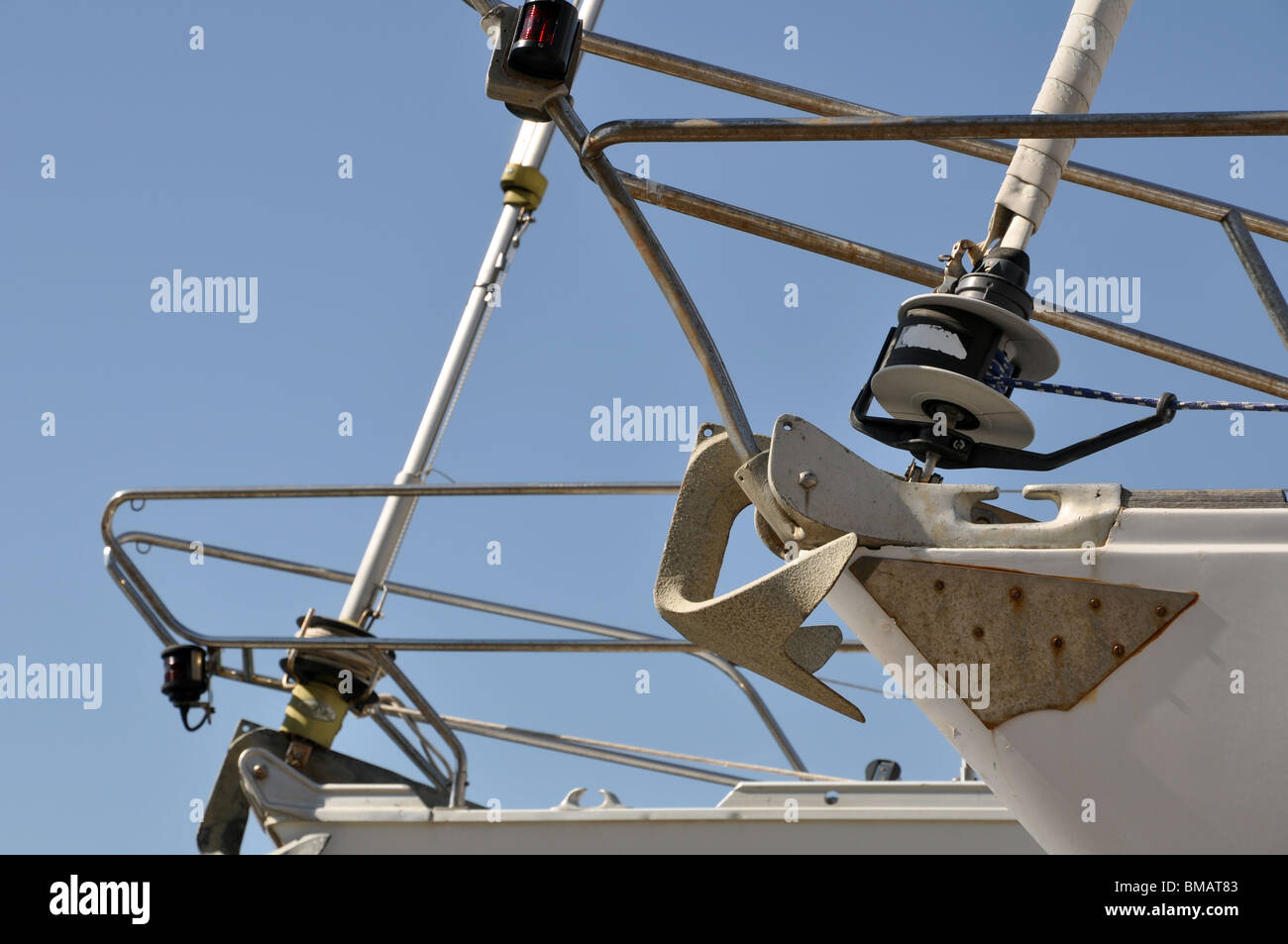 the prow of two sailboats in a dockyard Stock Photo - Alamy
