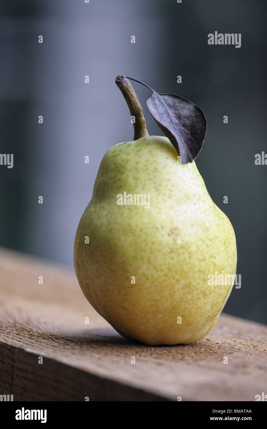 A Pear With A Leaf On The Stem Stock Photo - Alamy