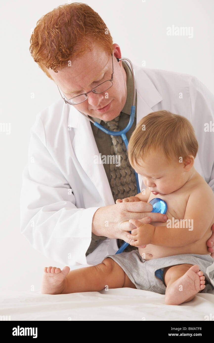 A Pediatrician Examining A Baby Stock Photo - Alamy