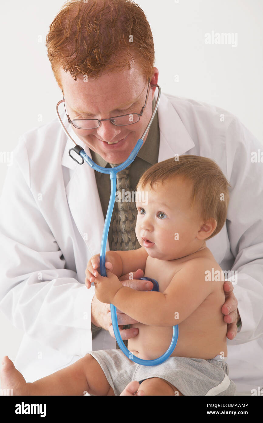 A Pediatrician Examining A Baby Stock Photo - Alamy