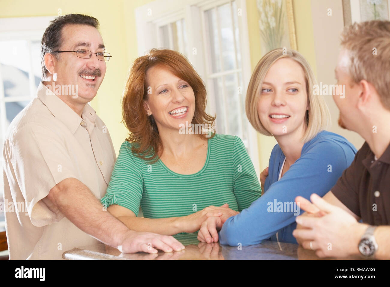 Middle aged siblings discussing hi-res stock photography and images - Alamy