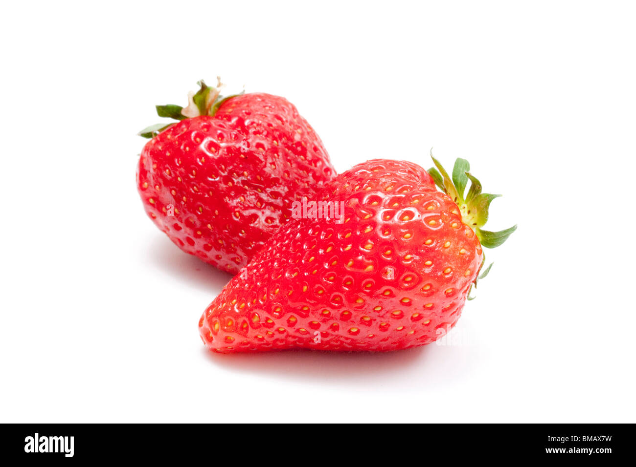 Two strawberries isolated on white background Stock Photo - Alamy