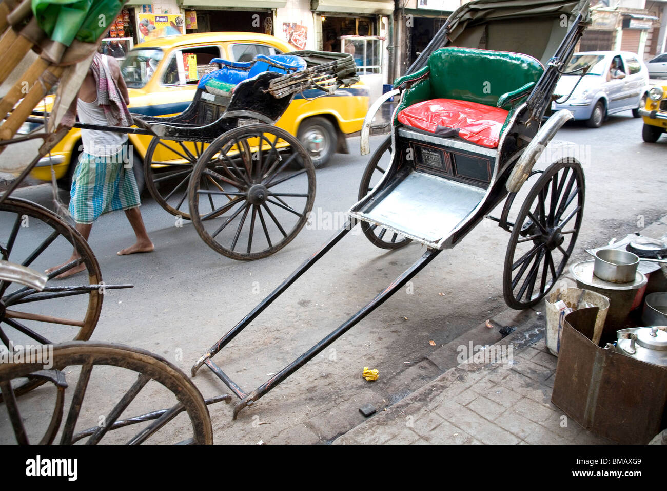 Empty hand rickshaw ; manual labor rickshaw puller with vehicle ; Park ...