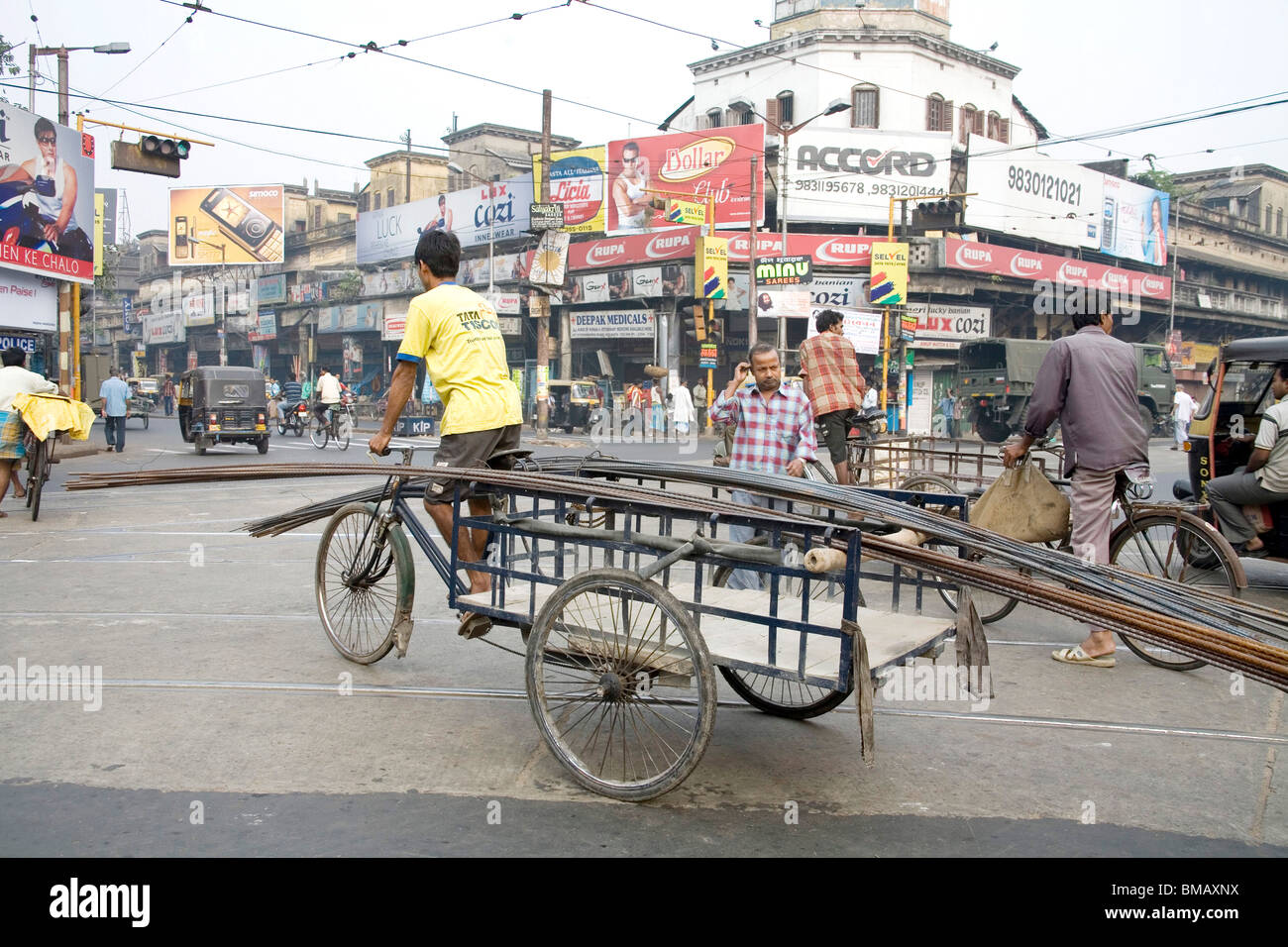 Street scene ; cycle rickshaw rider riding heavy load ; Calcutta now ...