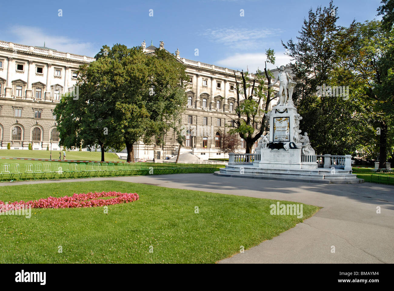 Statue of Mozart in the Burggarten garden. Flowers treble clef . Vienna ...
