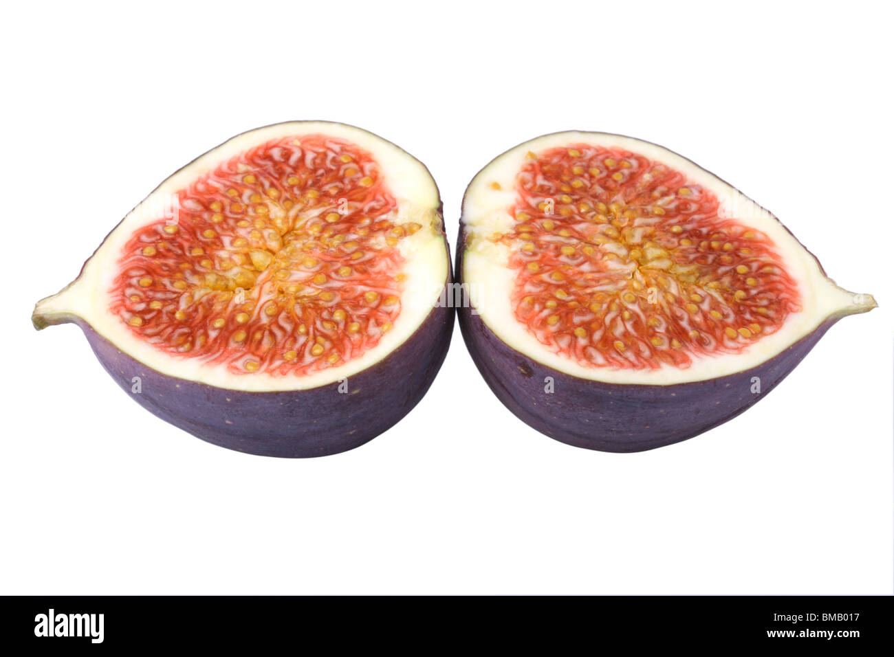 Fresh halved fig isolated on white background Stock Photo - Alamy