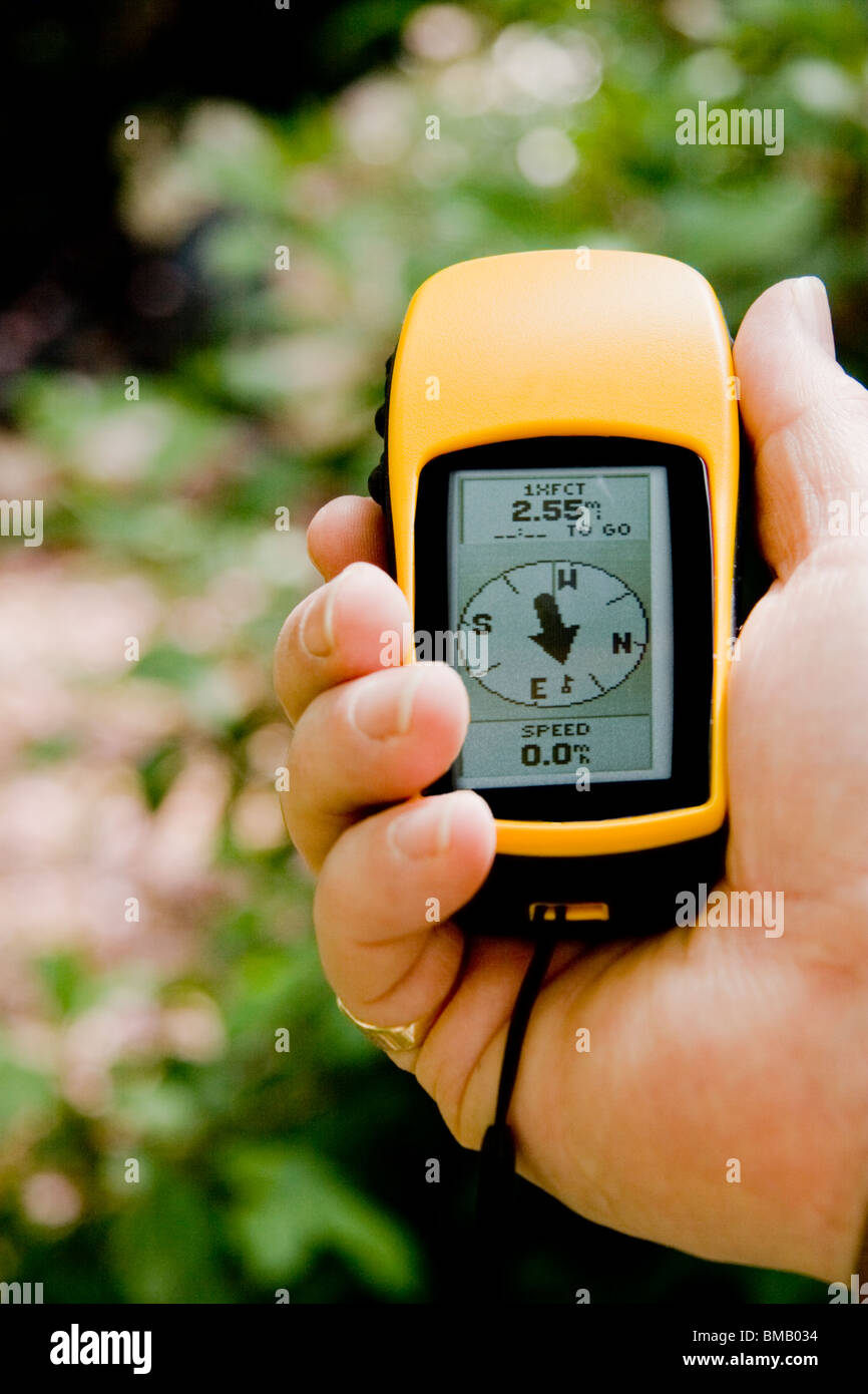 Male hand holding an Orienteering satellite navigation device Stock ...