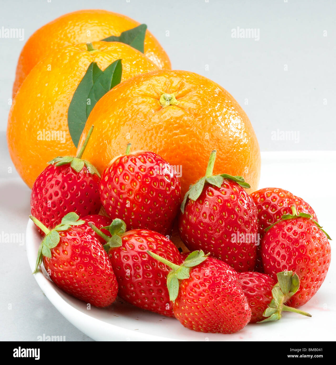 Oranges and strawberries Stock Photo - Alamy