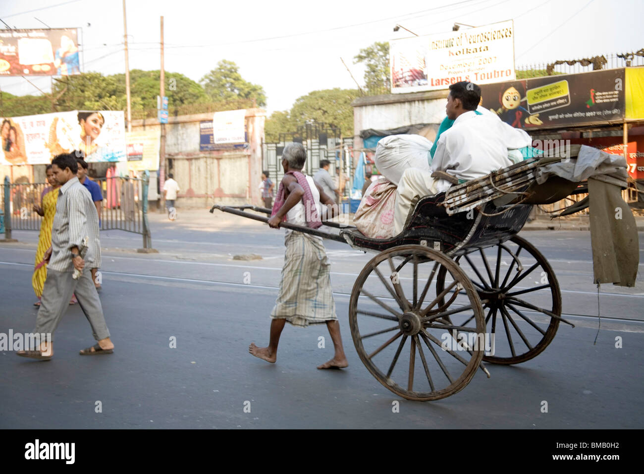 Hand pulling rickshaw puller pulling hi-res stock photography and ...